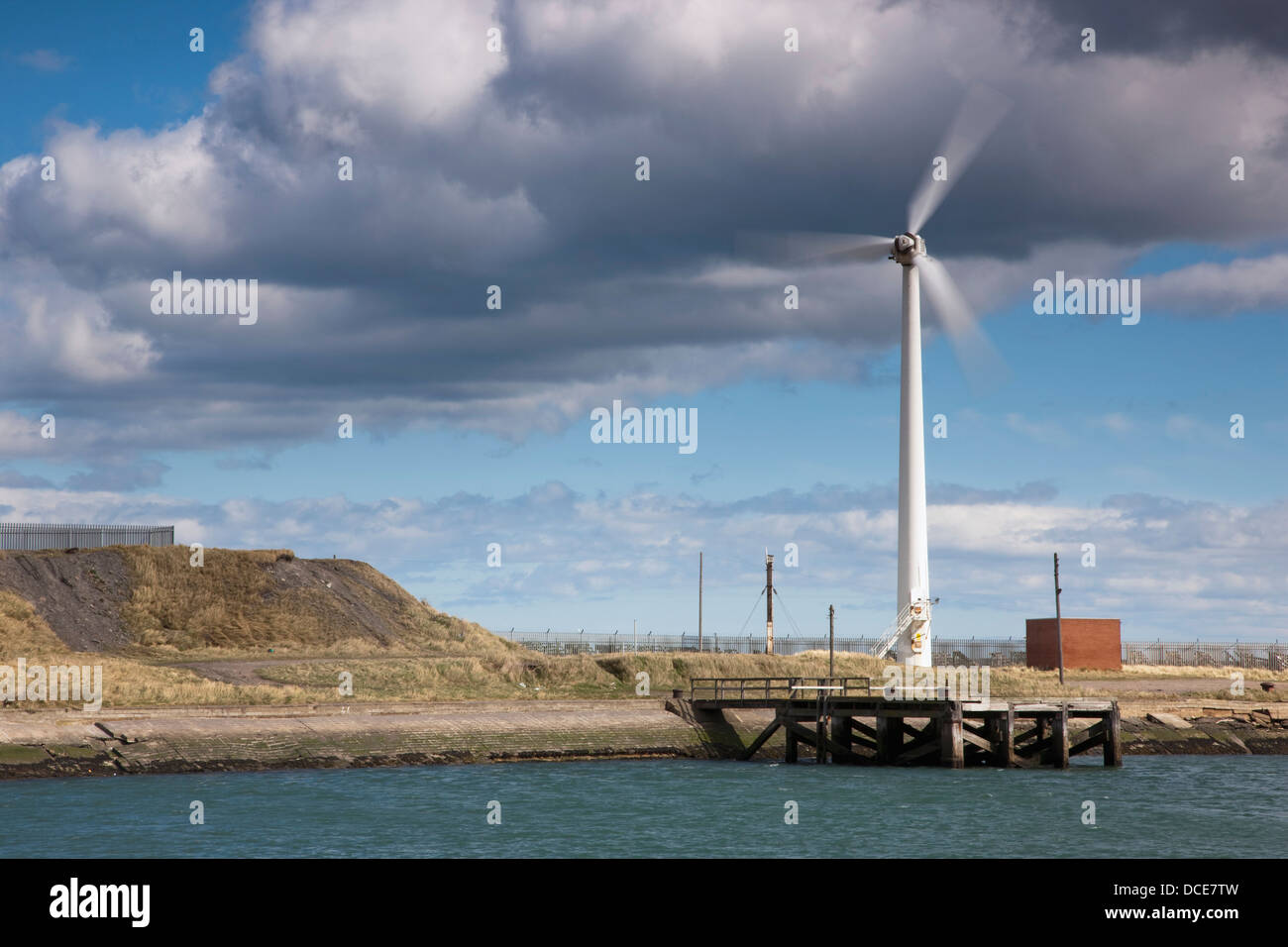 Blyth, Northumberland, England; Wind Turbine By Waterfront Stock Photo ...