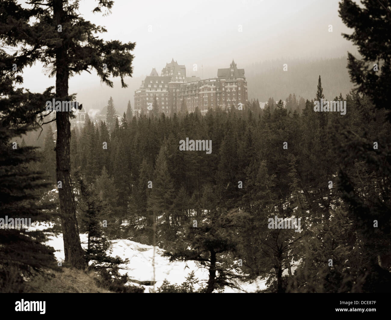 View Of Banff Hotel Through Woods, Banff, Alberta, Canada Stock Photo ...