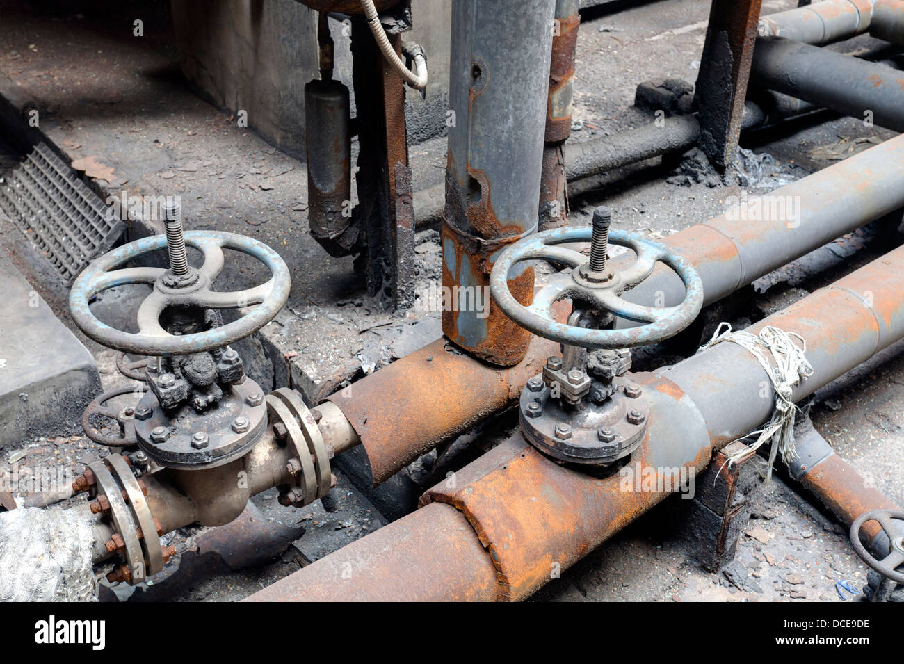Pipes and valves in an abandoned factory Stock Photo - Alamy