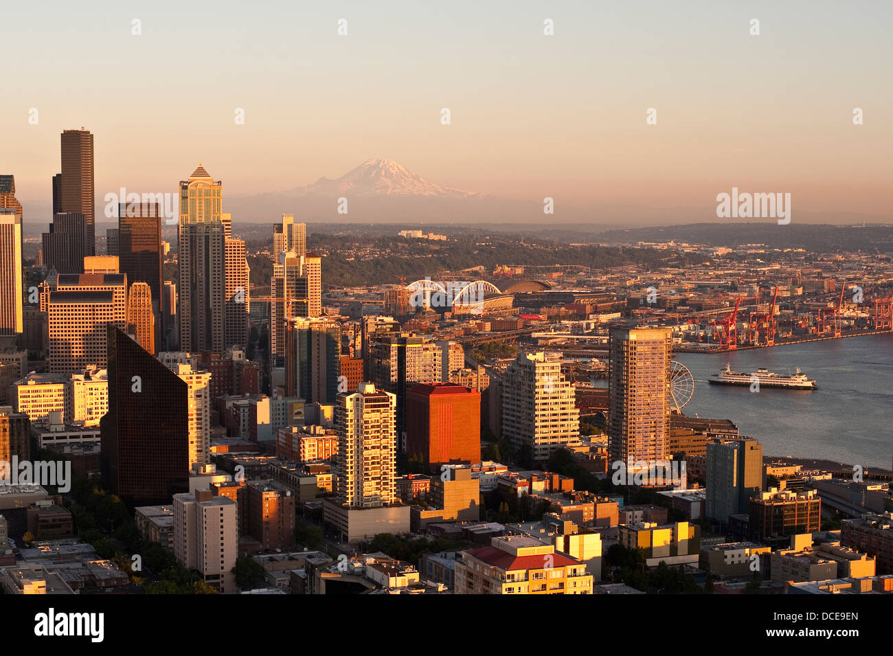Retro image of Seattle skyline with Mount Rainier and ferry boat at ...