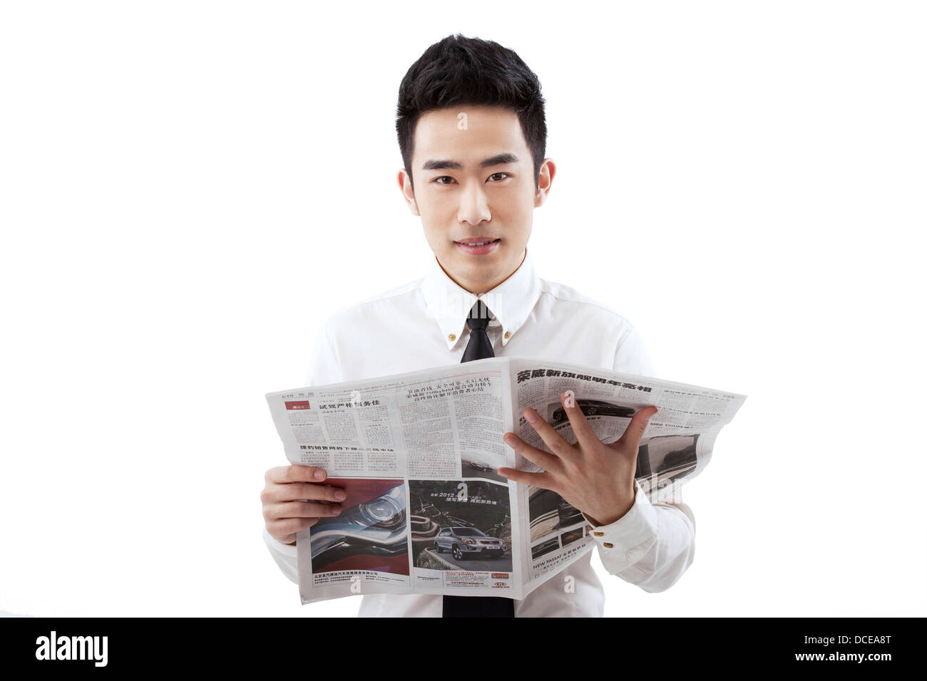 Business people reading the newspaper Stock Photo - Alamy