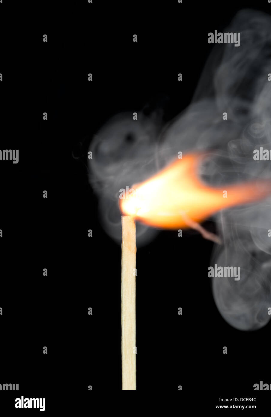 Ignition of a match, with smoke on dark background Stock Photo - Alamy
