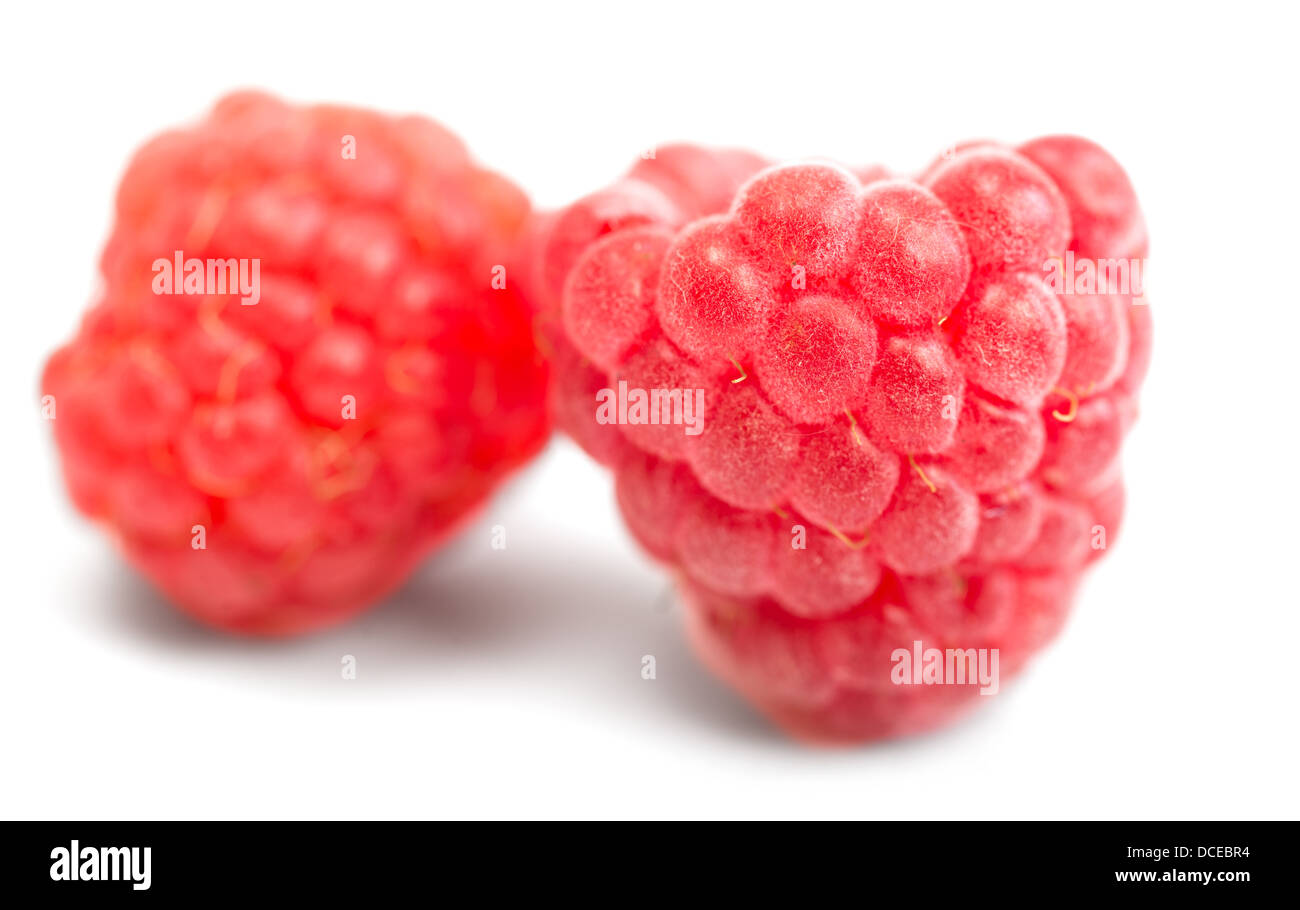 two ripe red raspberry isolated on white background Stock Photo - Alamy