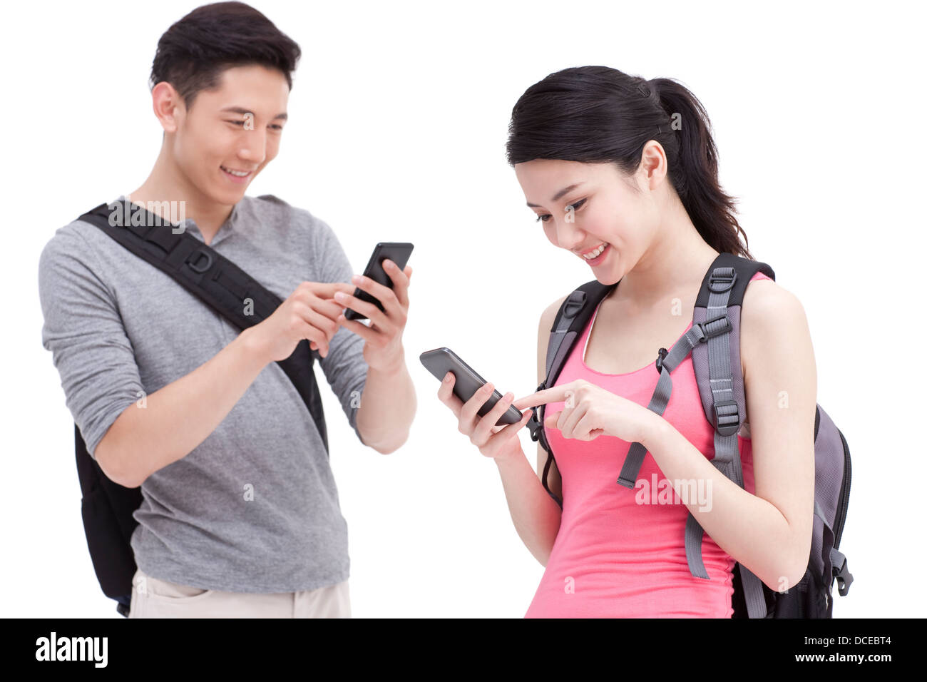 Cheerful college students with smart phones Stock Photo - Alamy