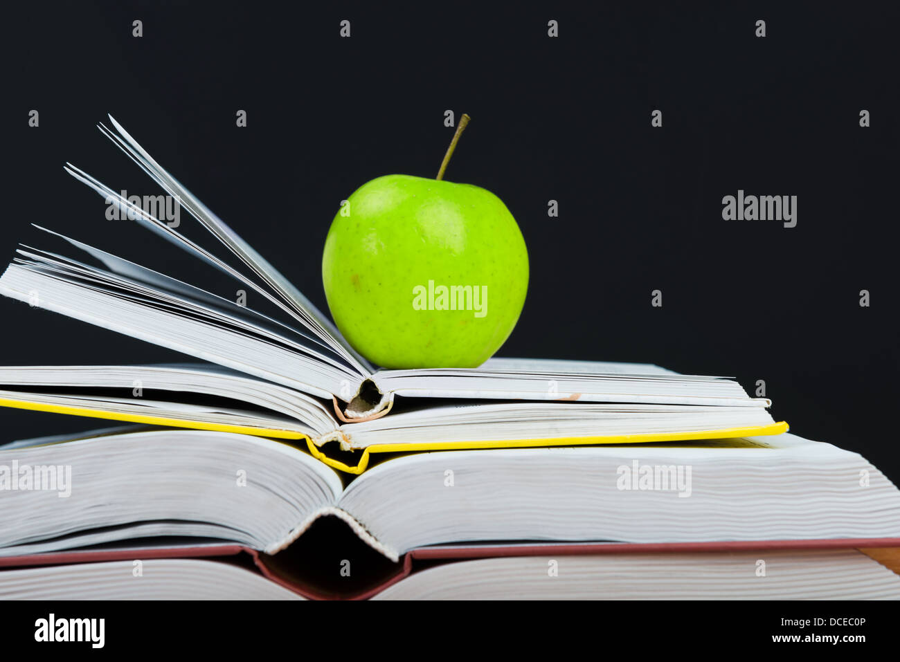 Black green books apple hi-res stock photography and images - Alamy