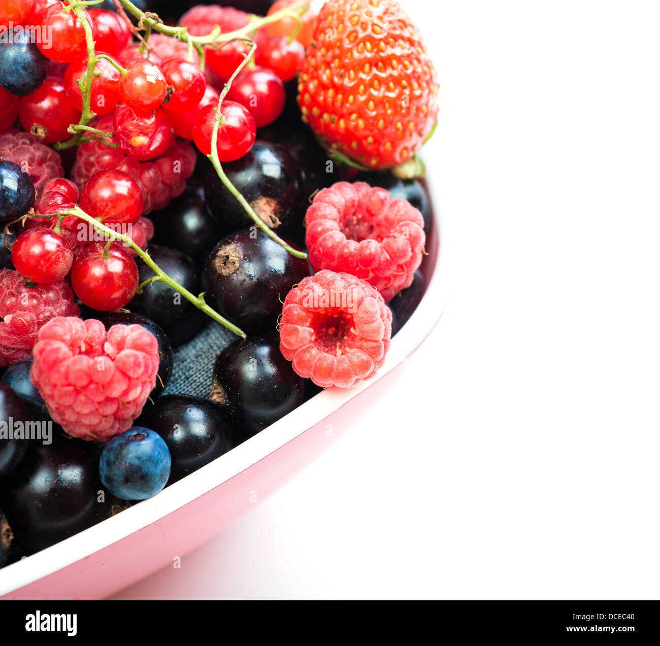 Blueberry, strawberry, raspberry, black and red currant in red bowl ...