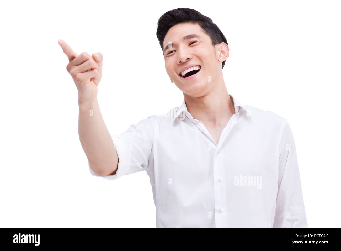 Cheerful young man pointing Stock Photo - Alamy