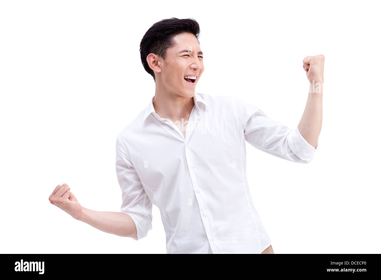 Cheerful young man punching the air Stock Photo - Alamy