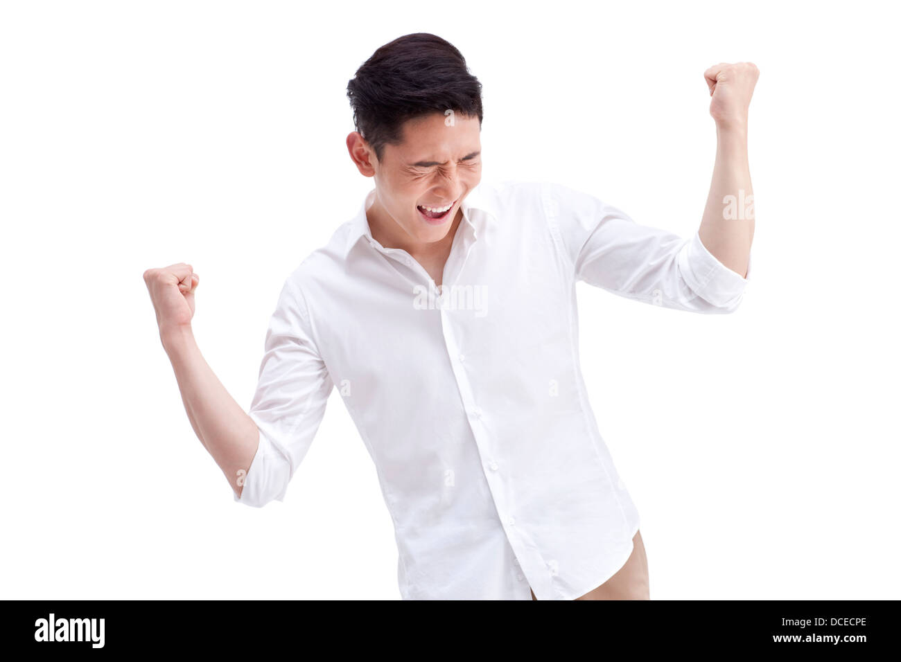 Cheerful young man punching the air Stock Photo - Alamy