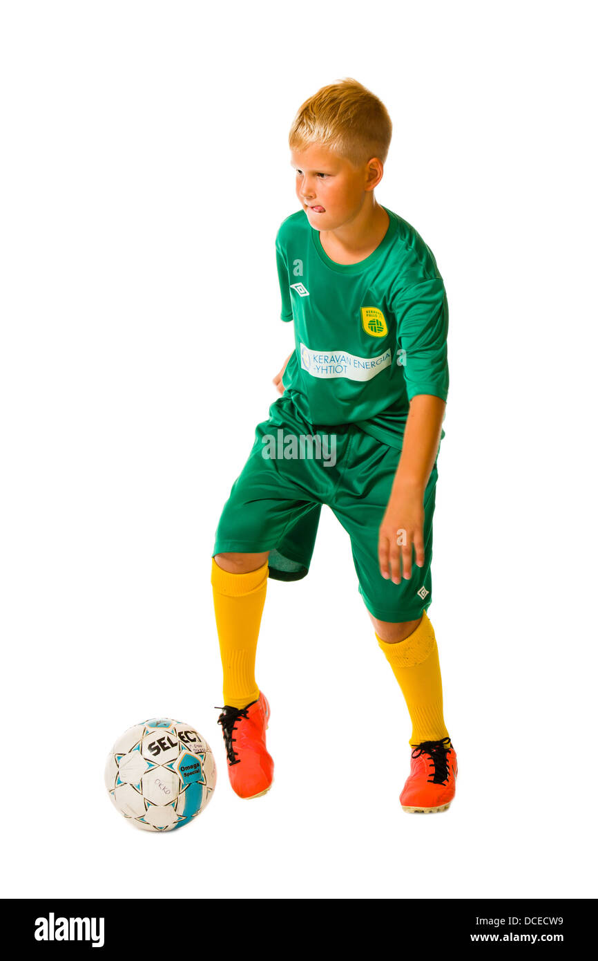 Young football player wearing green team uniform, studio shot, white ...