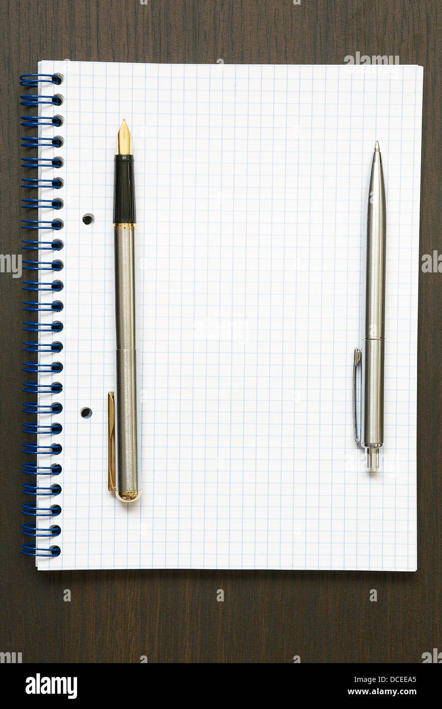 Pen on notebook background Stock Photo - Alamy