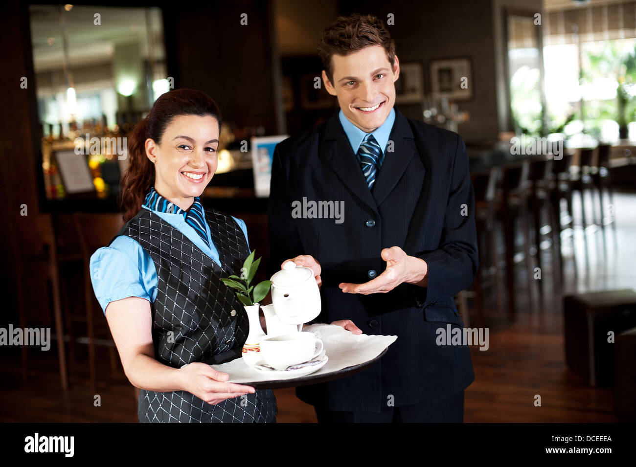 Waitress pouring tea hi-res stock photography and images - Alamy