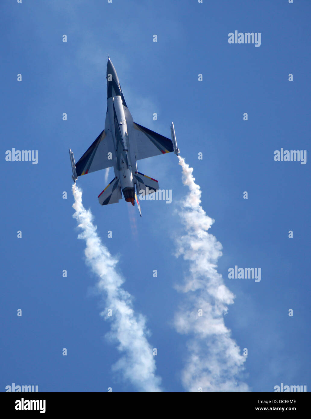 belgian air force f16 fighter jet showing smoke trails Stock Photo - Alamy
