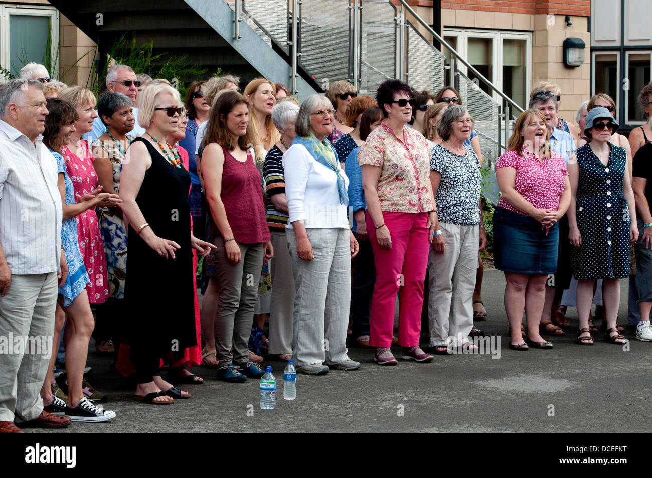 A community choir singing at Warwick Folk Festival, UK Stock Photo - Alamy