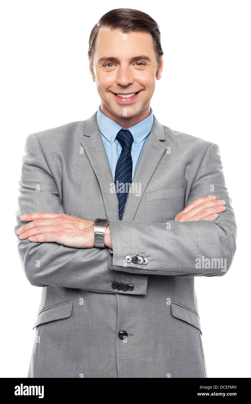 Half length portrait of handsome smiling male executive posing with his ...