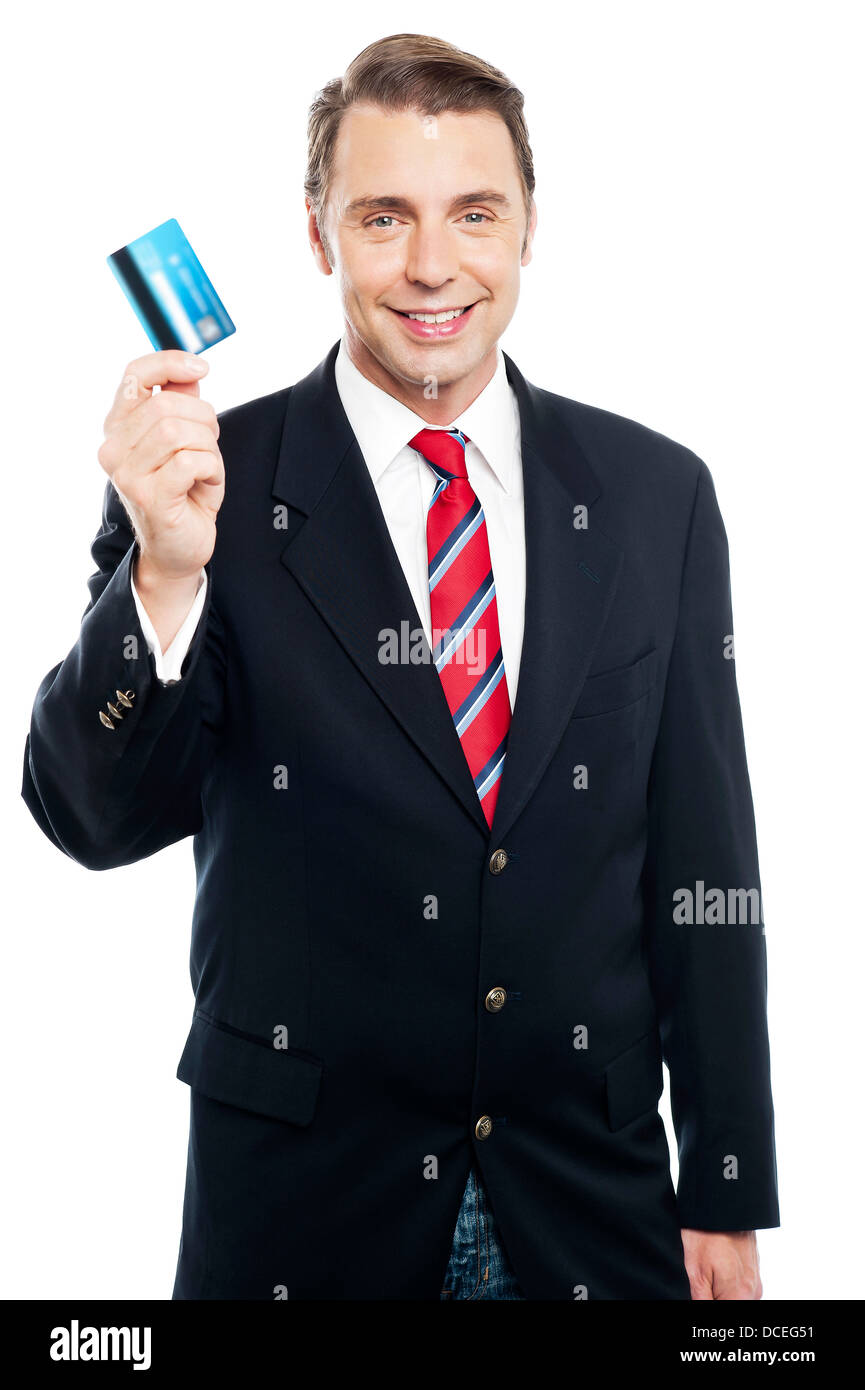 An entrepreneur showing debit card to camera isolated against white ...