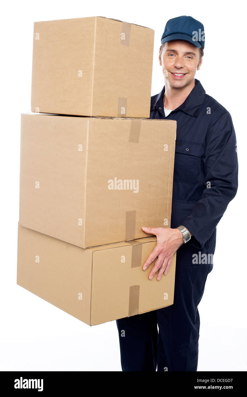 Working man delivering stack of cardboard boxes. Courier delivery Stock ...
