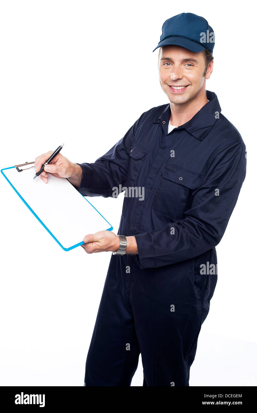 Courier delivery guy getting signature from customer after the delivery ...