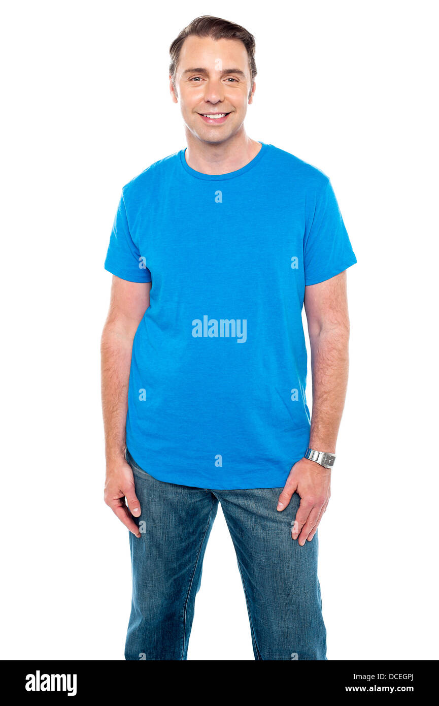 Cheerful calm male model posing in trendy casuals against white ...