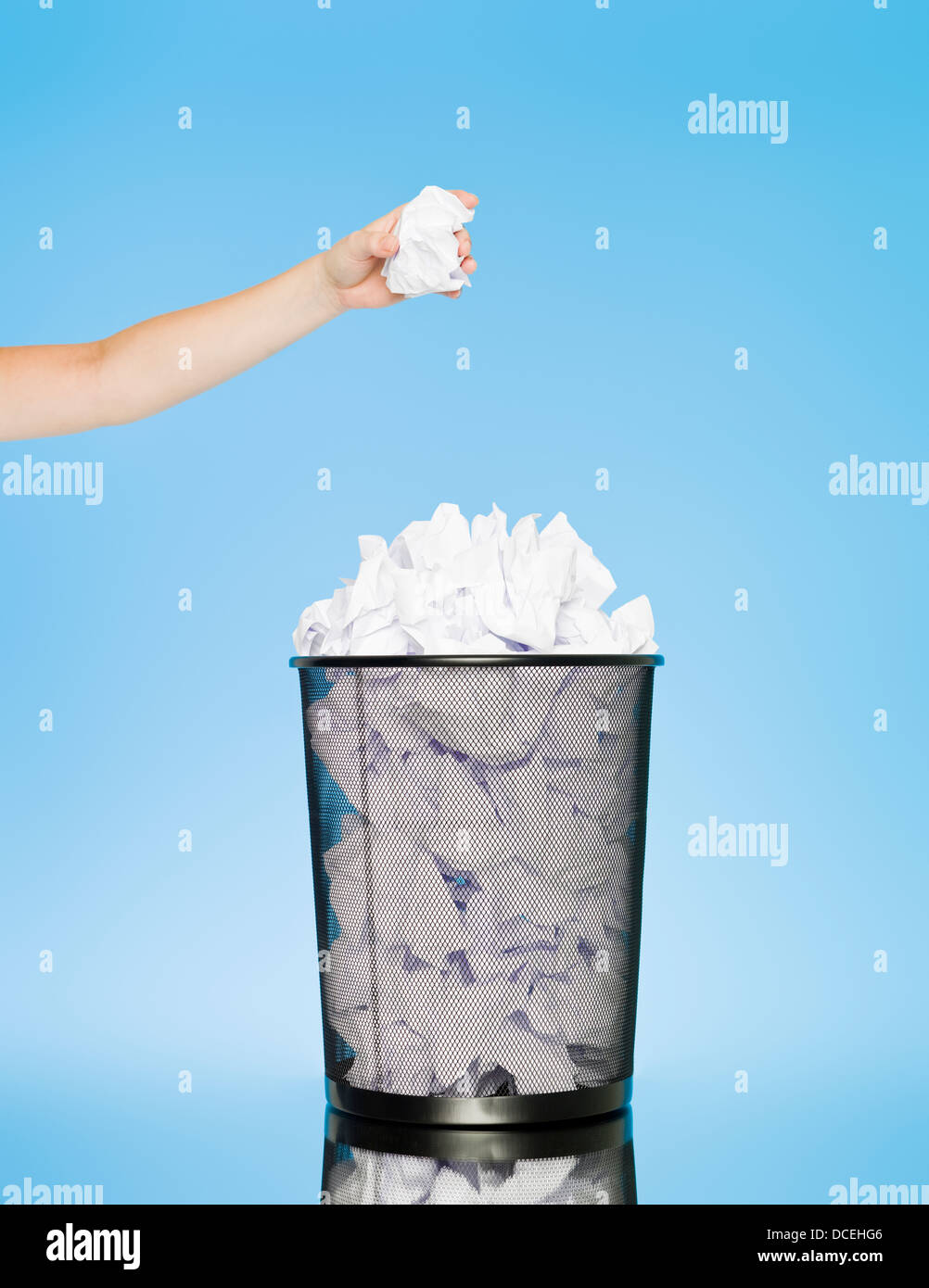 trowing a paper into a wastebasket Stock Photo - Alamy