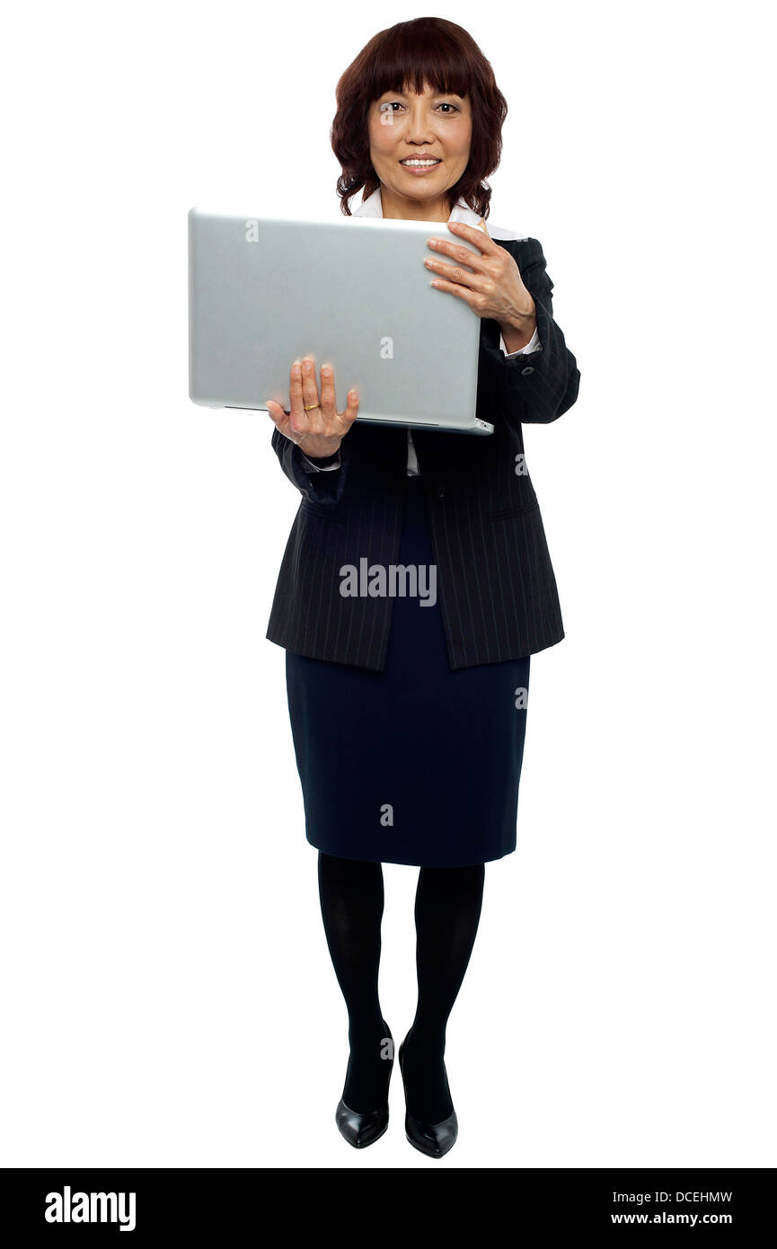 Full length portrait of business representative holding laptop Stock ...