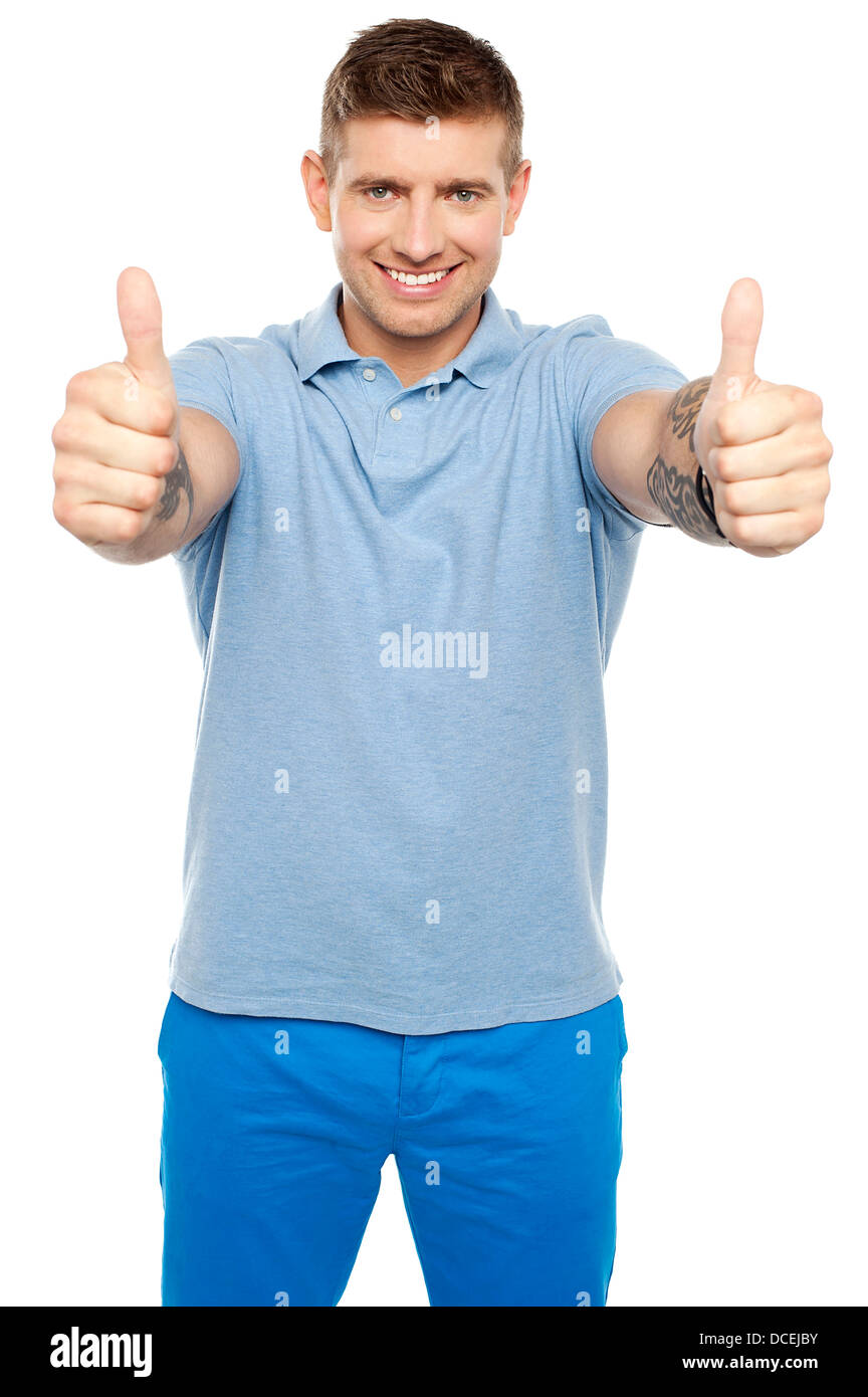 Joyous caucasian male showing double thumbs up isolated against white ...