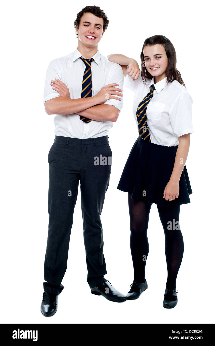 School girl resting hand on her classmates shoulder. Full length ...