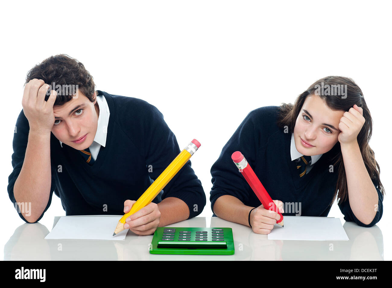 Confused students holding their heads during examination. Trying to ...