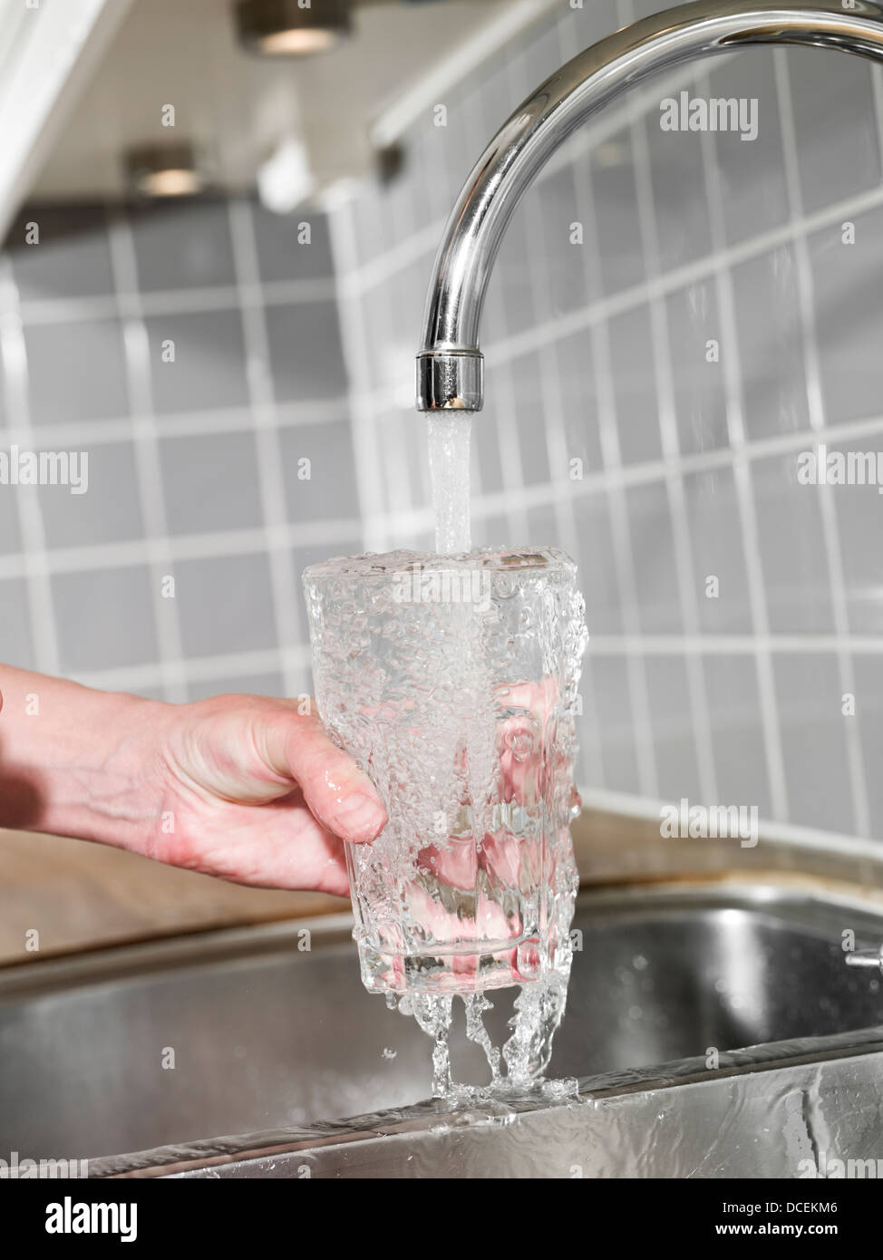 Filling a glass Stock Photo - Alamy