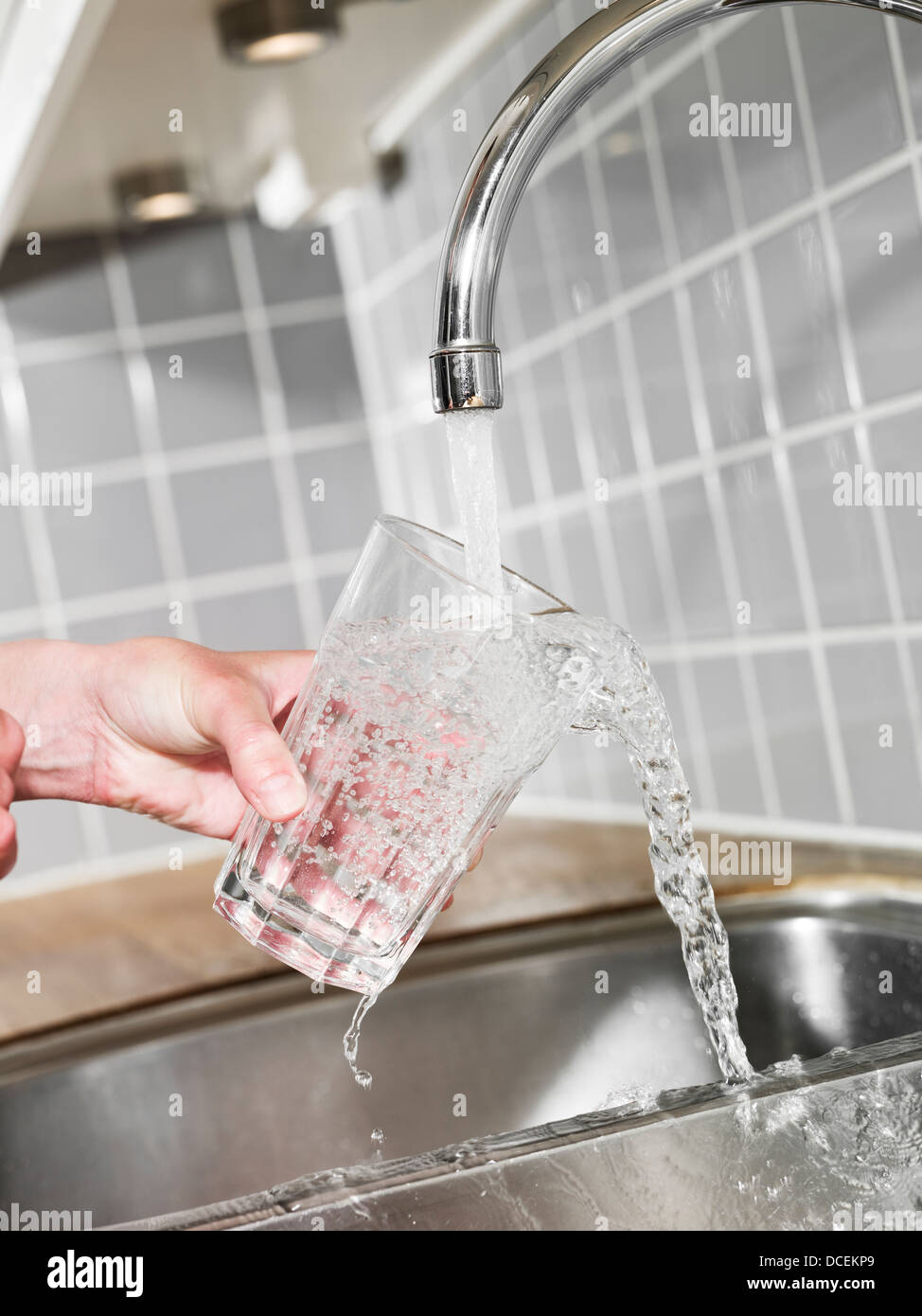 Filling a glass Stock Photo - Alamy