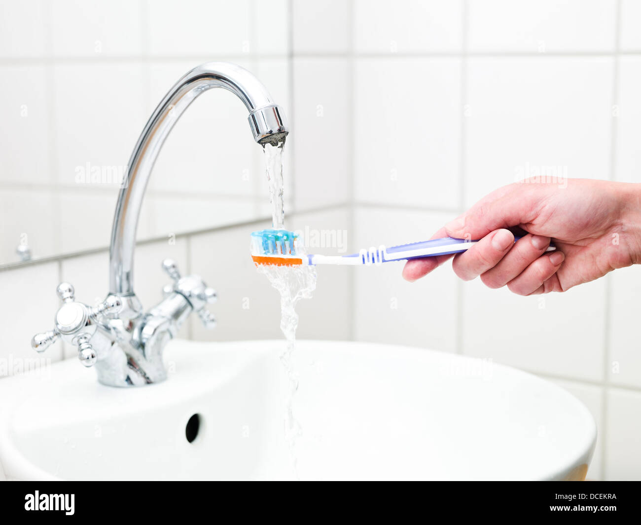 Human holding toothbrush Stock Photo - Alamy