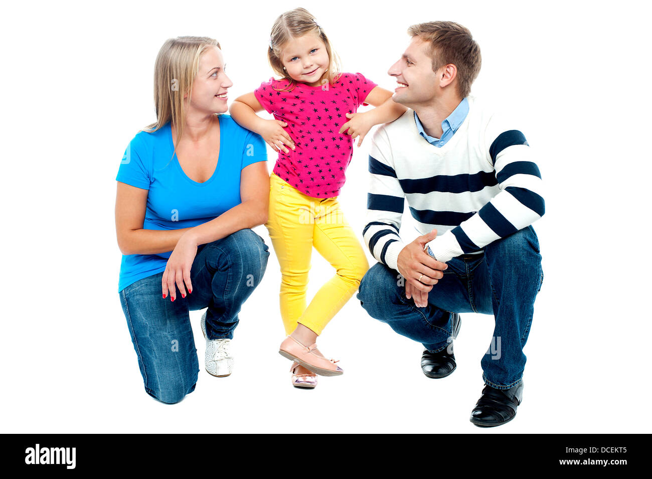 Happy family with kid together isolated on white. Parents squatting ...