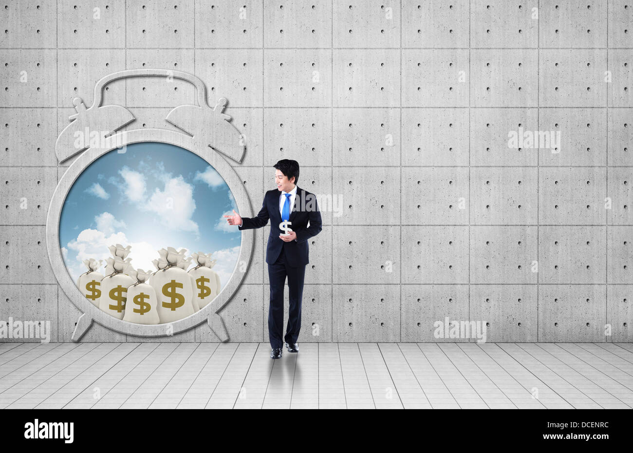 a businessman standing next to a clock Stock Photo - Alamy