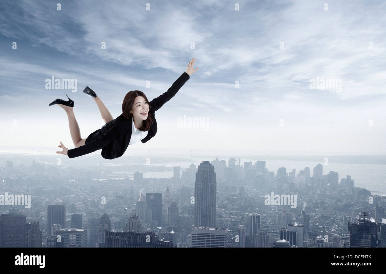 a business woman flying Stock Photo - Alamy
