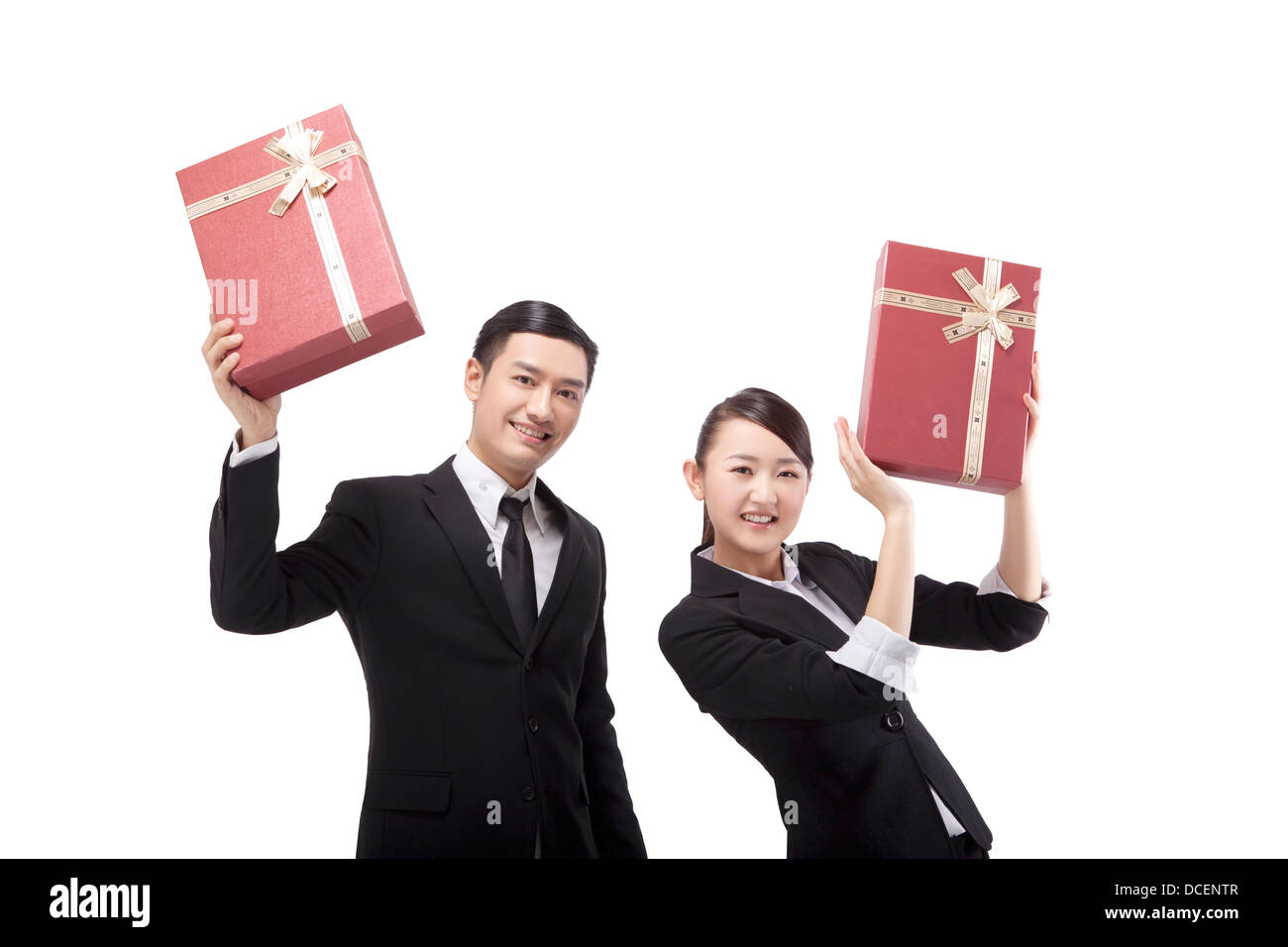 Business people with a gift box Stock Photo - Alamy