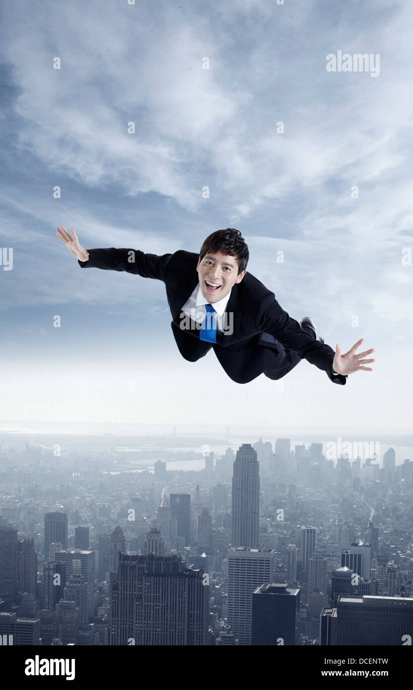 a business man flying Stock Photo - Alamy
