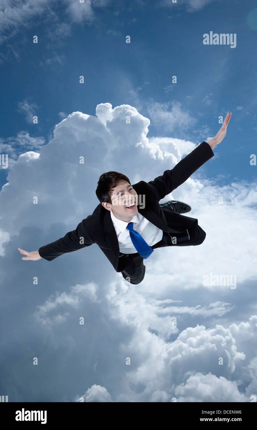 a business man flying Stock Photo - Alamy