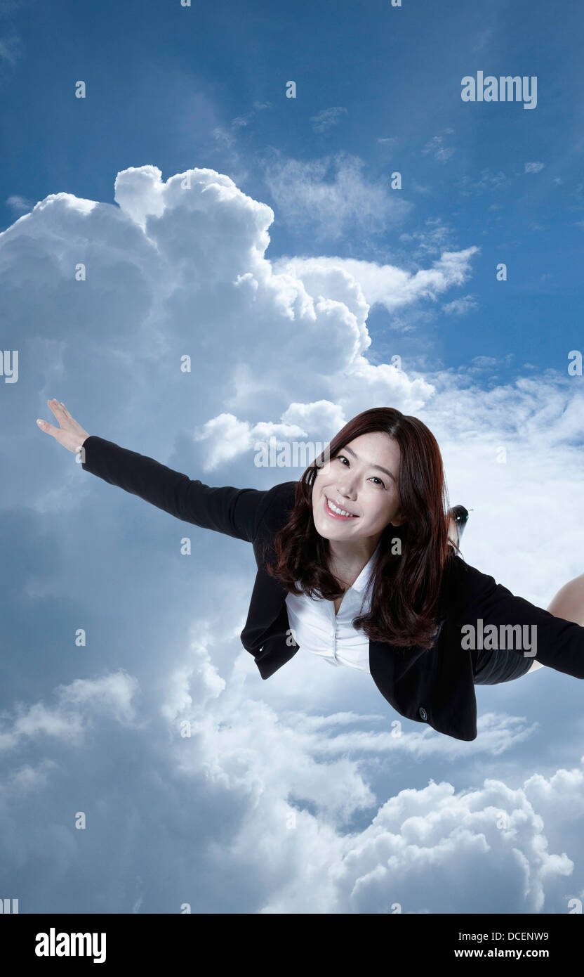 a business woman flying Stock Photo - Alamy