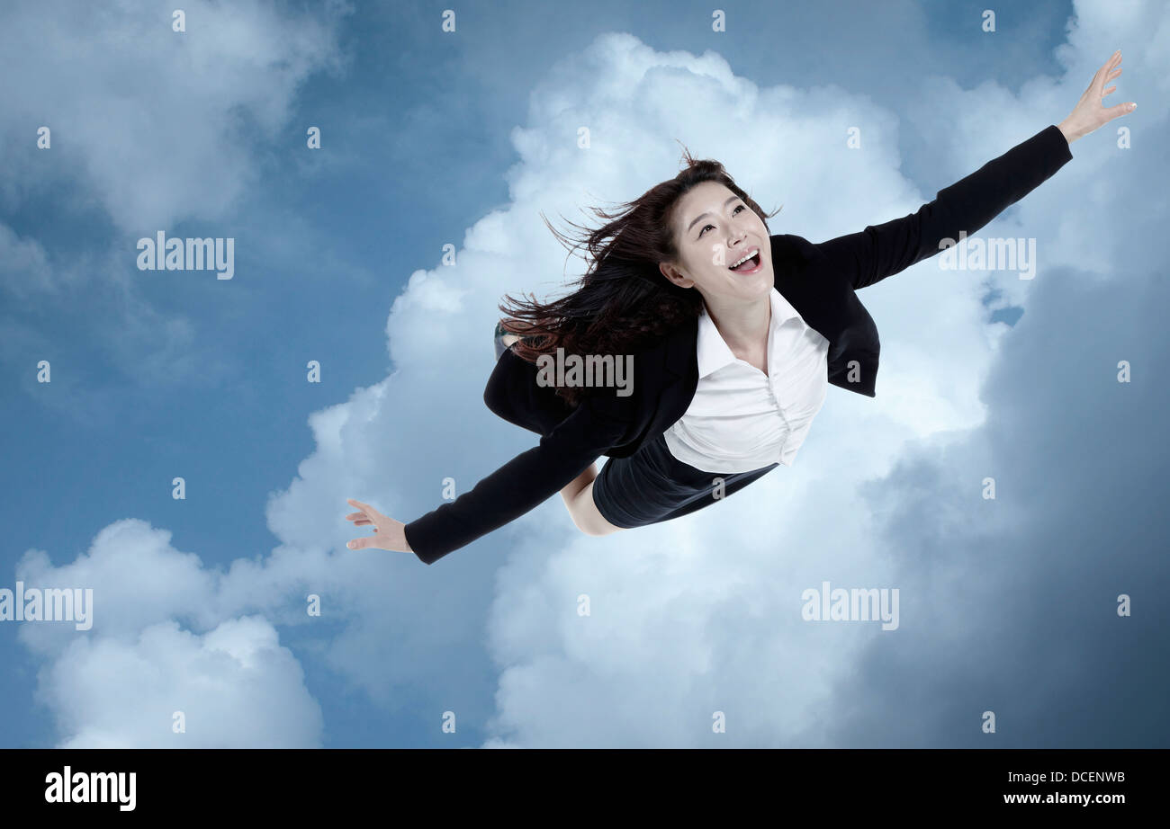 a business woman flying Stock Photo - Alamy