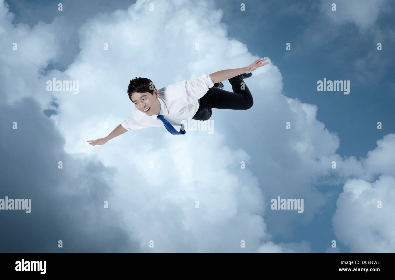 a business man flying Stock Photo - Alamy