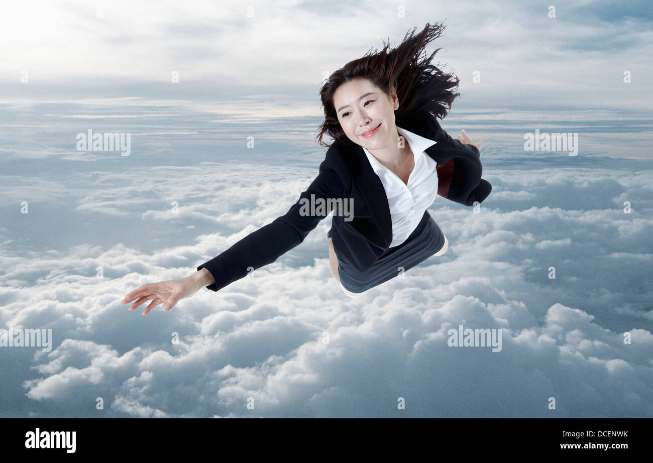 a business woman flying Stock Photo - Alamy