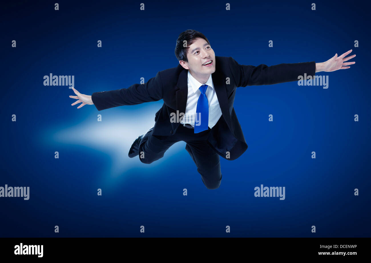 a business man flying Stock Photo - Alamy