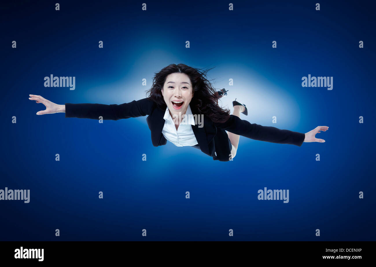 a business woman flying Stock Photo - Alamy