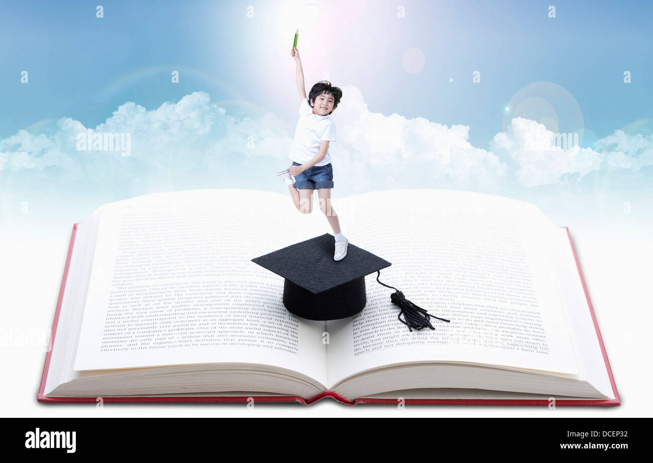a kid on a graduation hat Stock Photo - Alamy