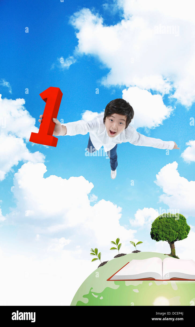 a kid flying with number one block Stock Photo - Alamy