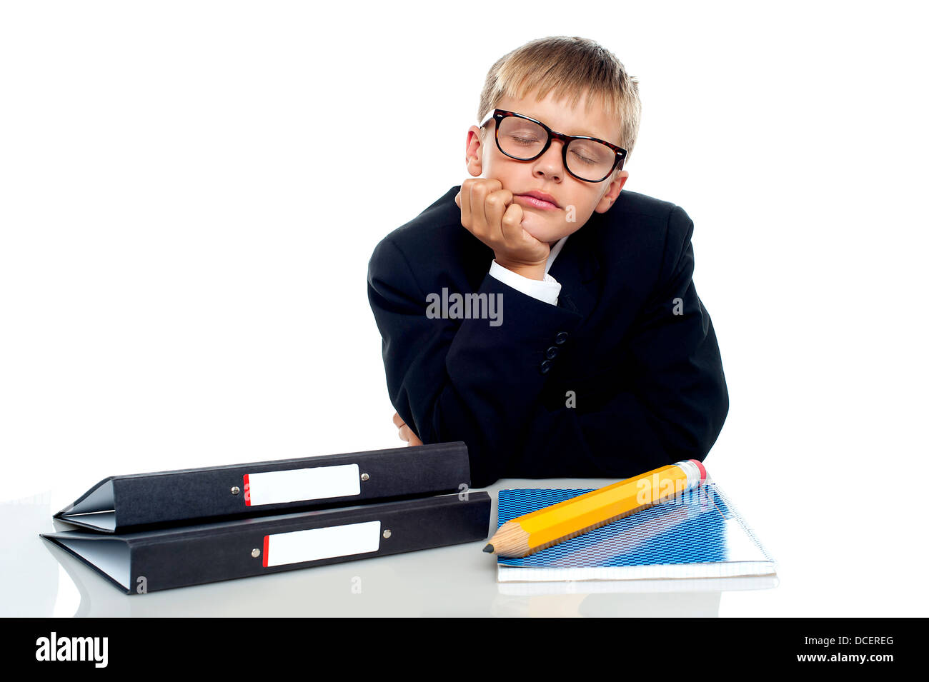 School boy in glasses dozing off during class Stock Photo - Alamy