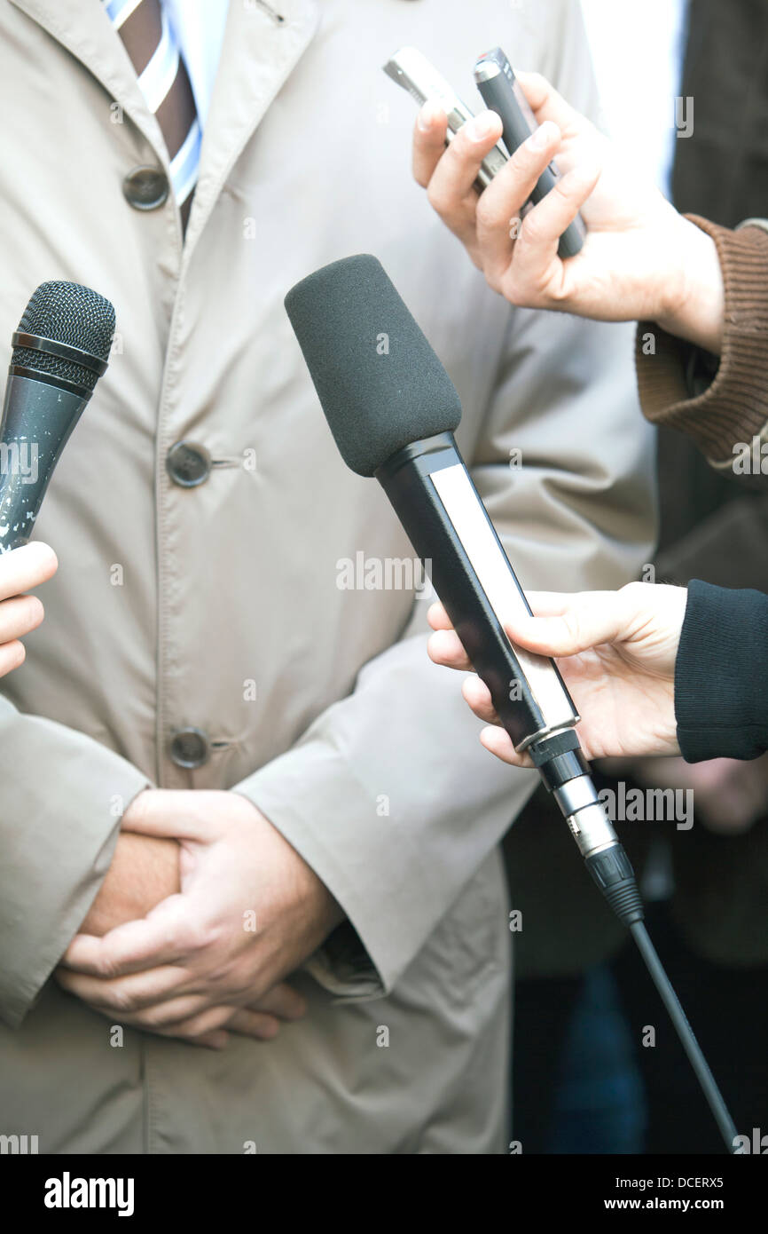 interview with media microphone held in front of businessman Stock ...