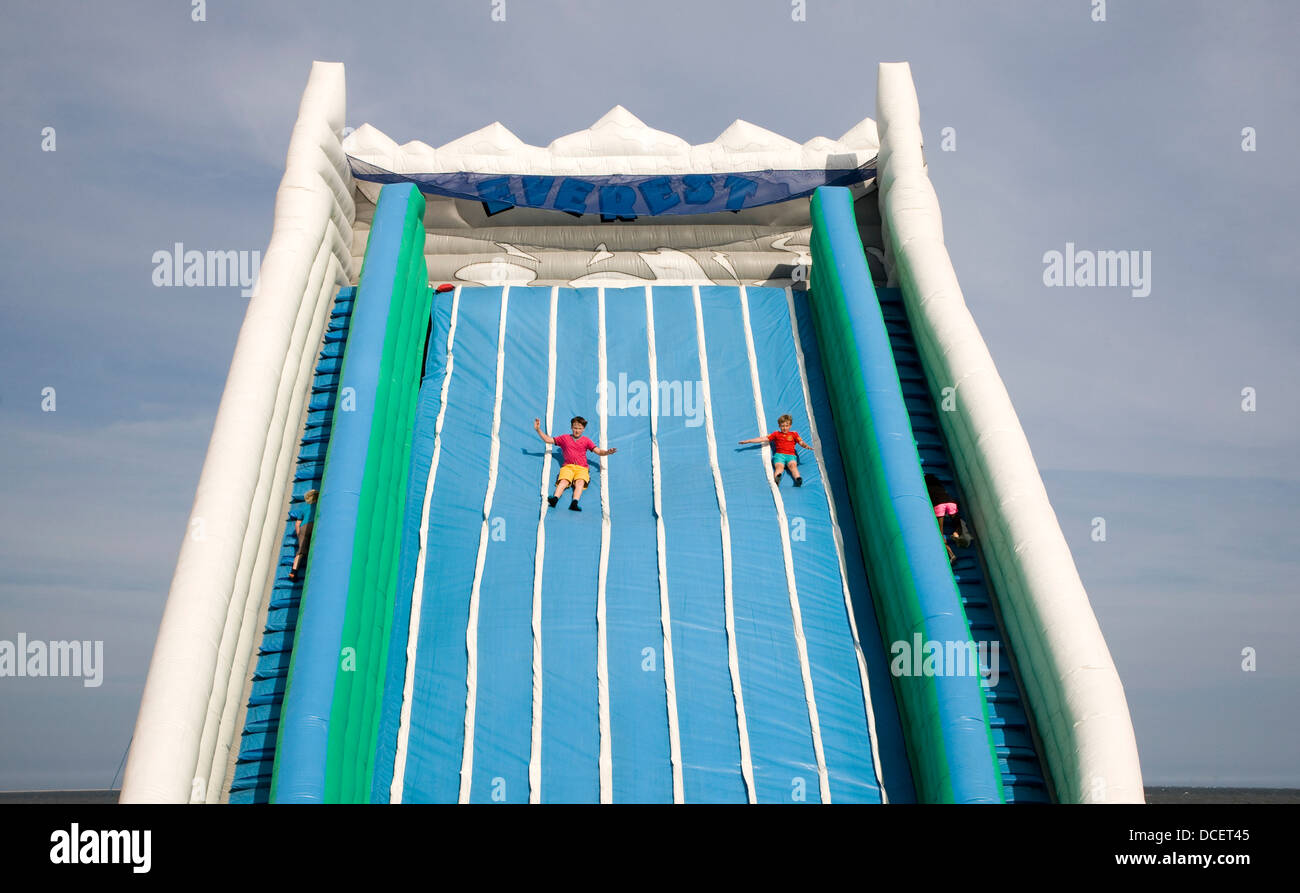 Children play on giant inflatable slide Great Yarmouth, Norfolk ...