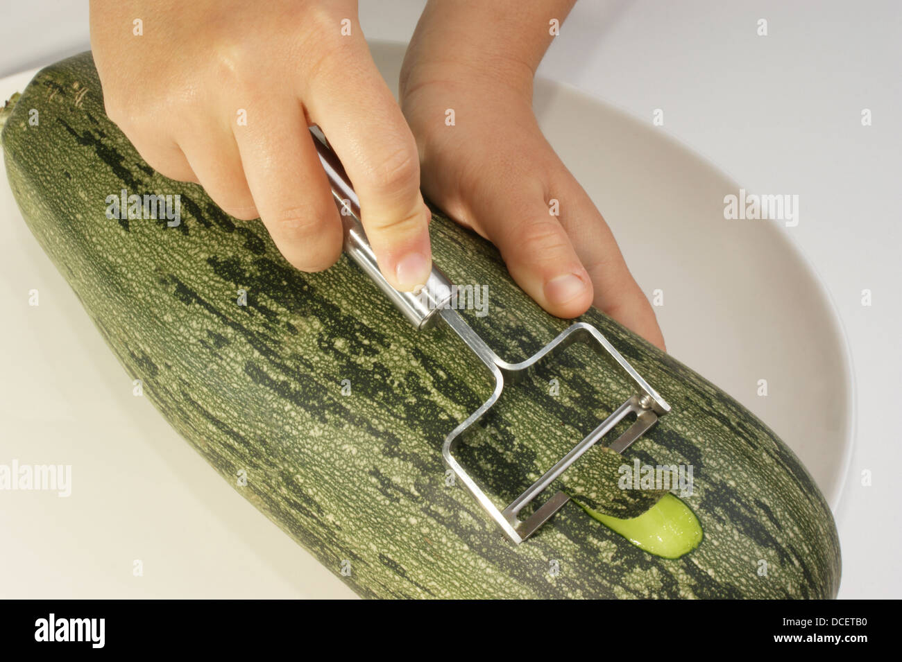 prepare one zucchini as healthy food Stock Photo - Alamy
