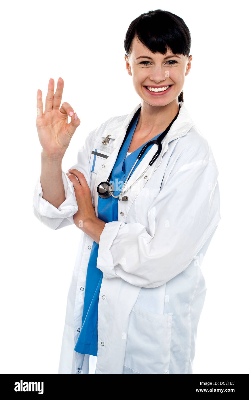 Confident smiling medical practitioner showing perfect sign isolated ...